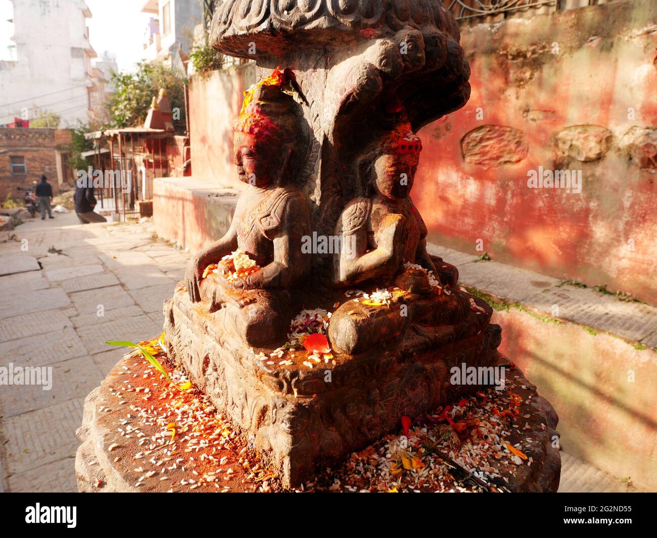 Ancient angel deity god buddha figure nepalese style in small shrine ...