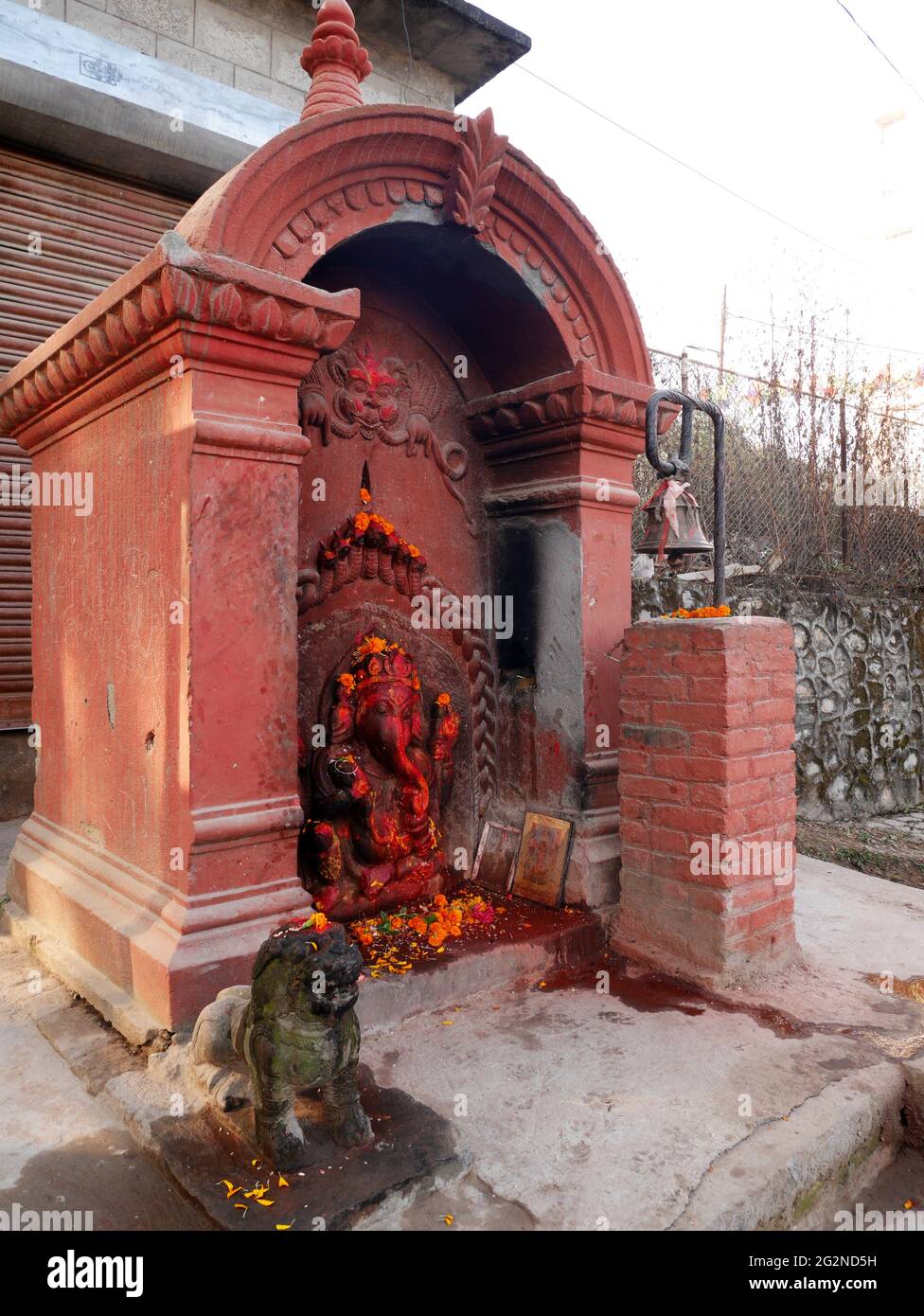 Ancient ganesha statue or ganesh figure lord of success in small shrine ...