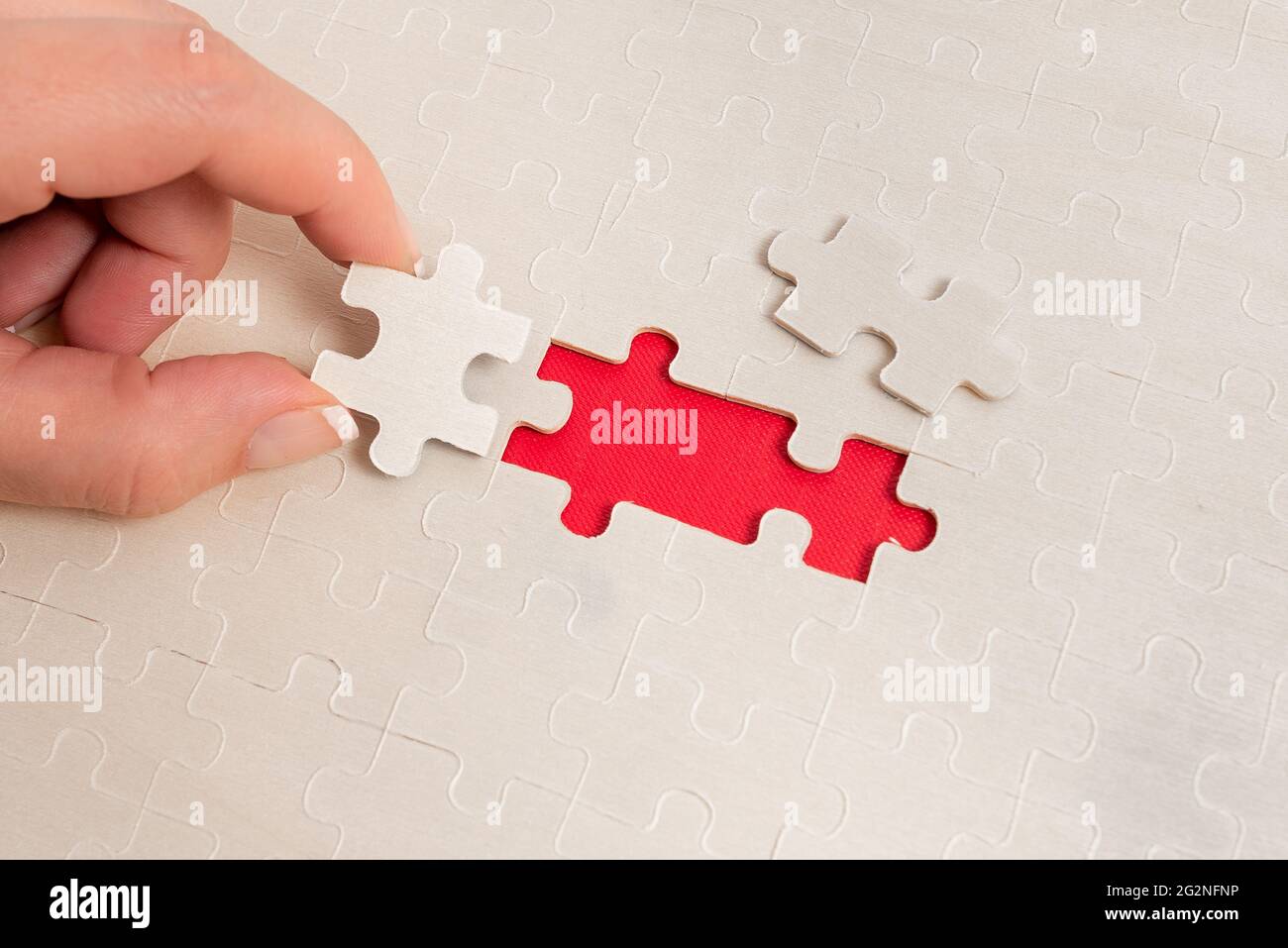 Building An Unfinished White Jigsaw Pattern Puzzle With Missing Last ...