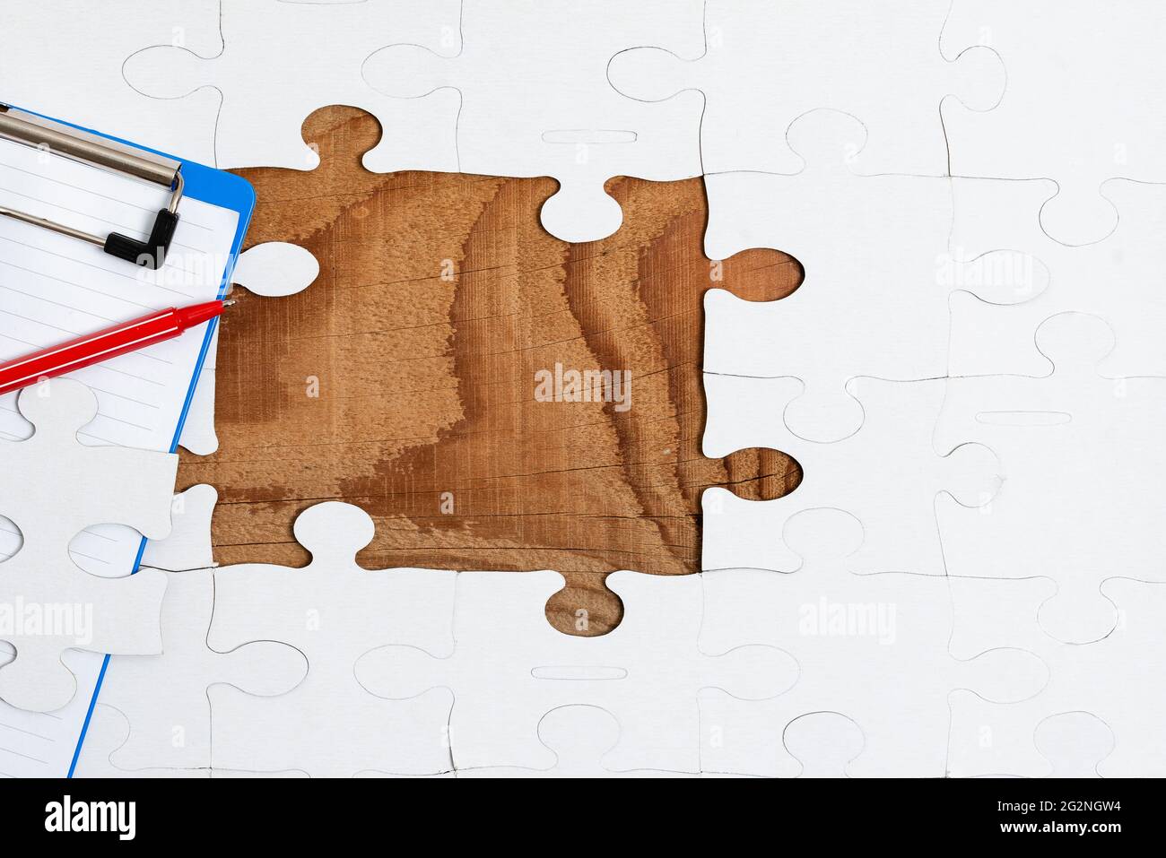 Building An Unfinished White Jigsaw Pattern Puzzle With Missing Last ...