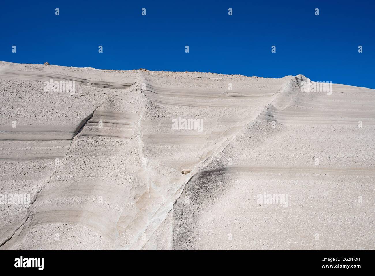 White stone formation, blue sky background. Lunar landscape at ...