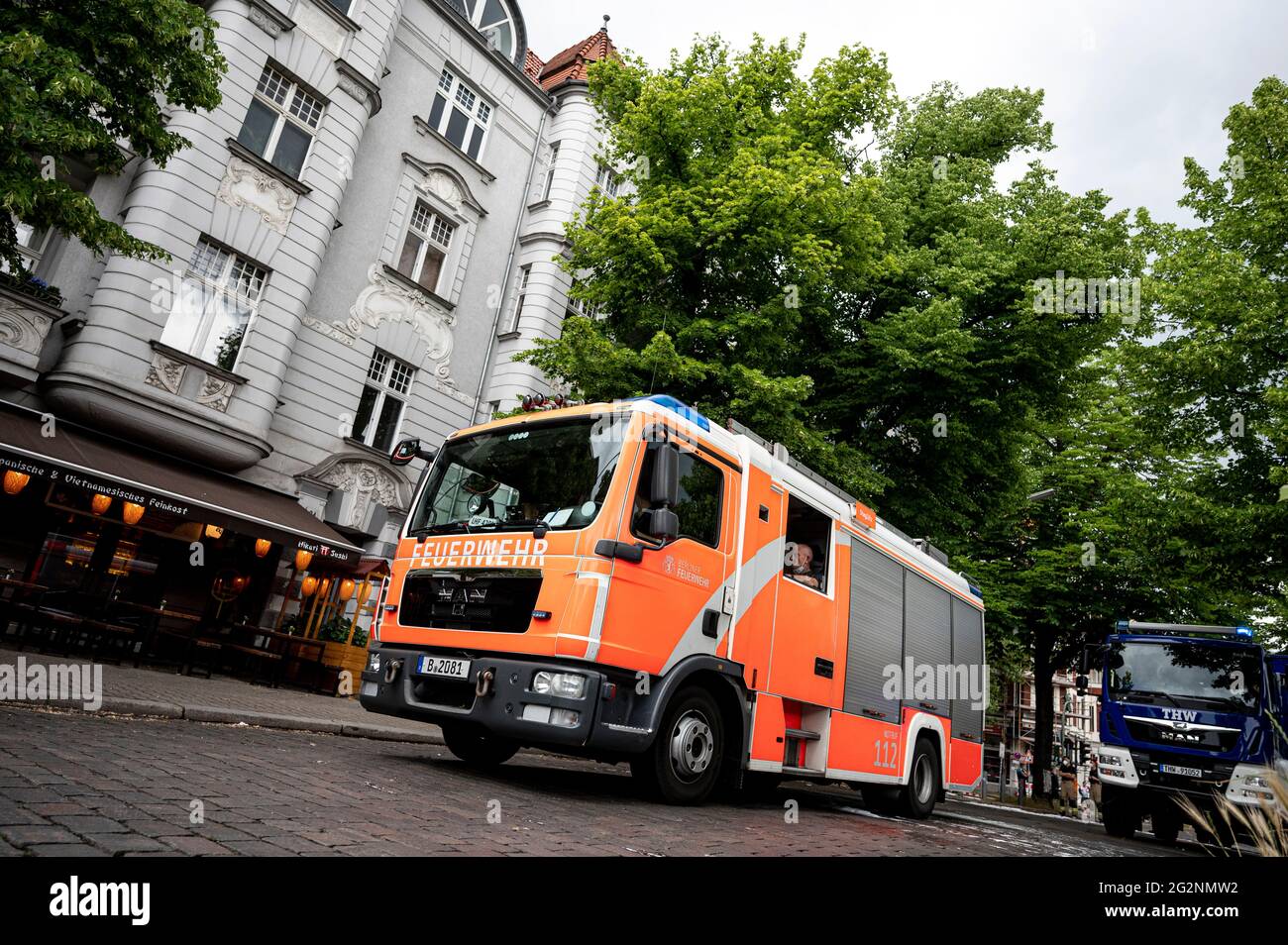 Berlin, Germany. 12th June, 2021. Firefighters stand in front of the ...