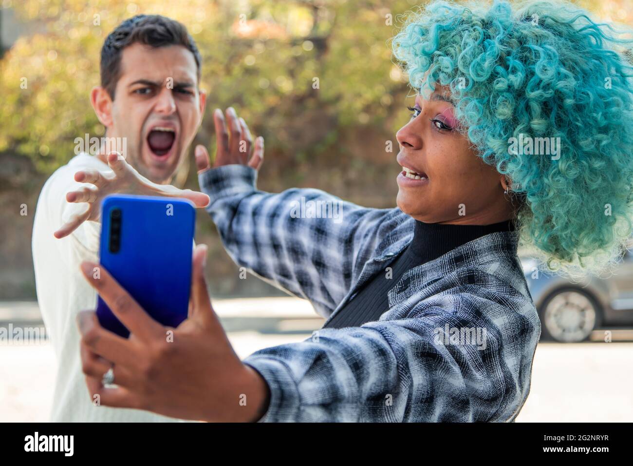 couple fighting over the mobile phone Stock Photo - Alamy
