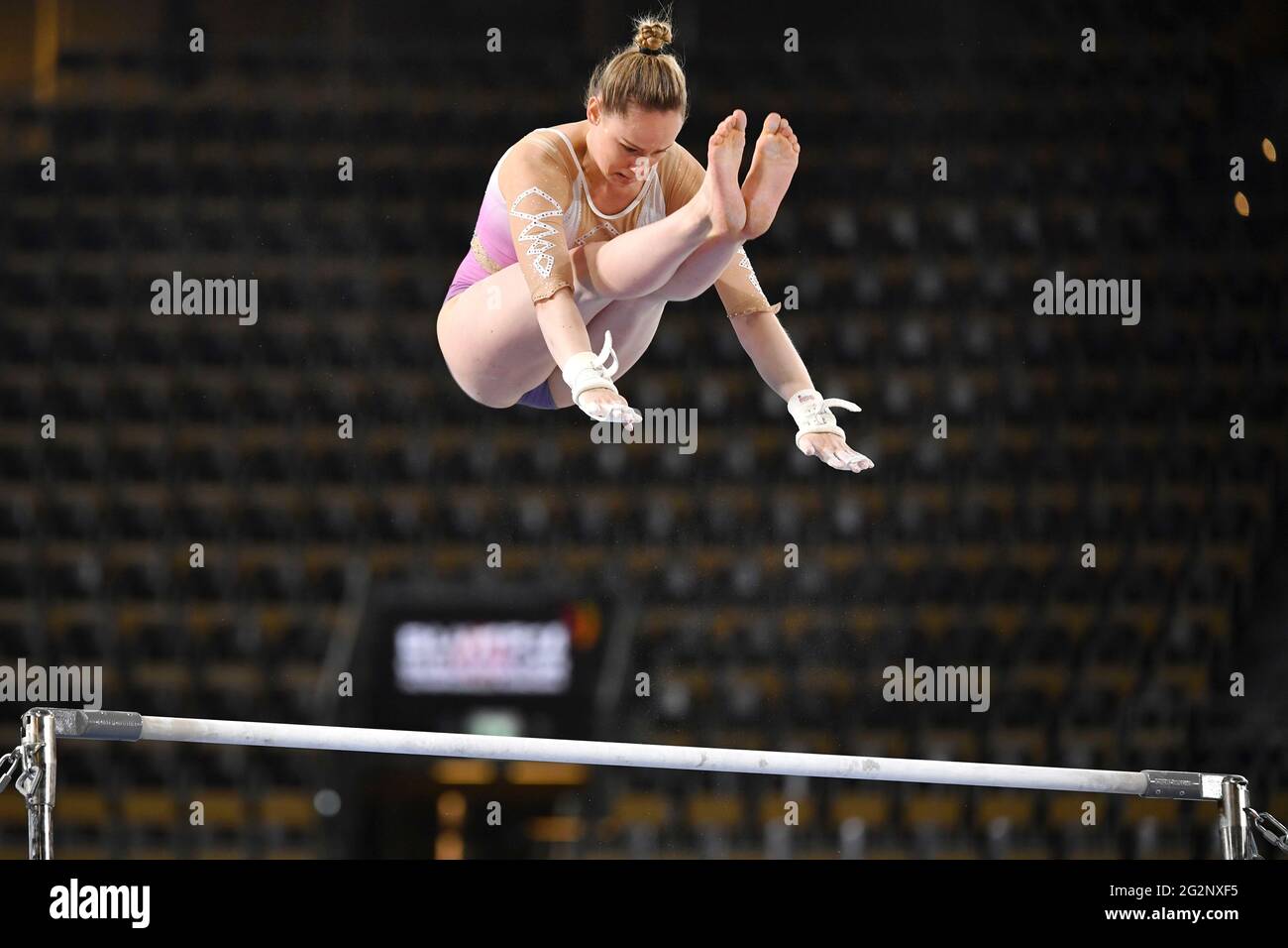 Munich, Germany. 12th June, 2021. Sarah VOSS (GER), action, uneven bars ...
