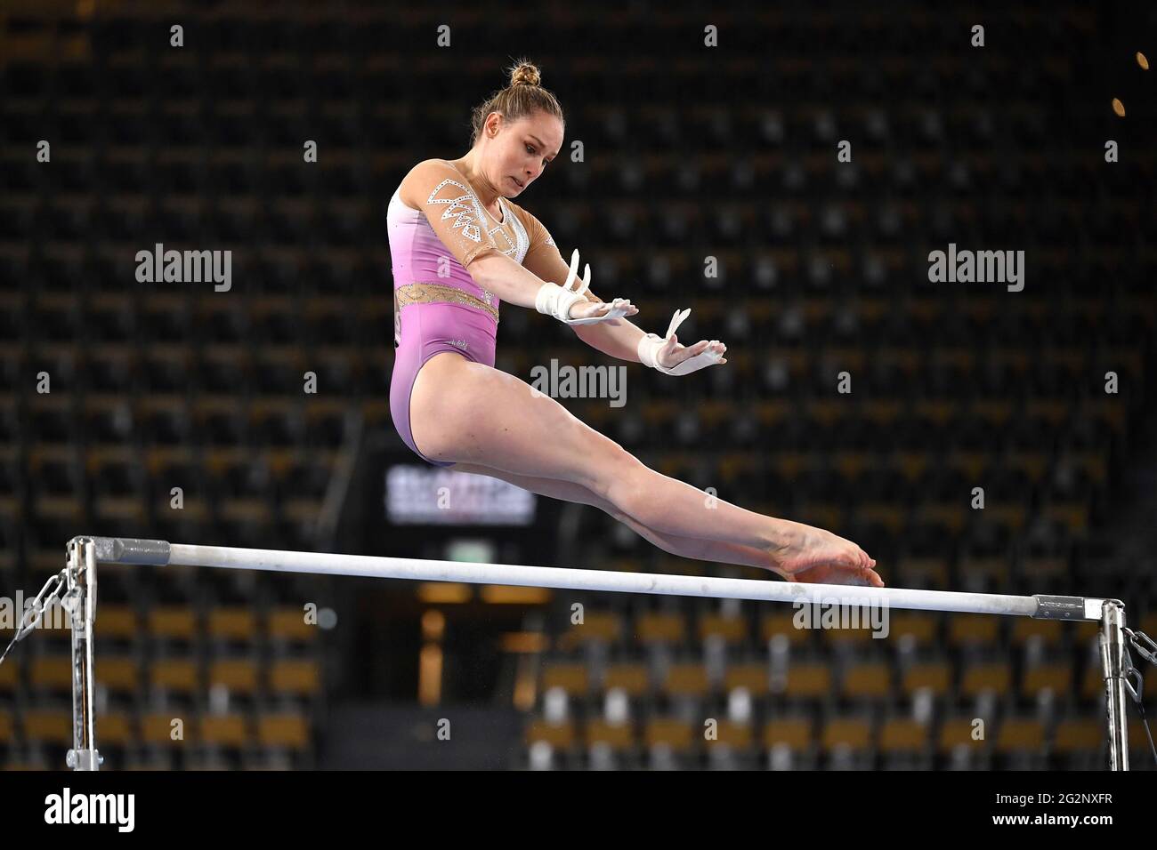 Munich, Germany. 12th June, 2021. Sarah VOSS (GER), action, uneven bars ...
