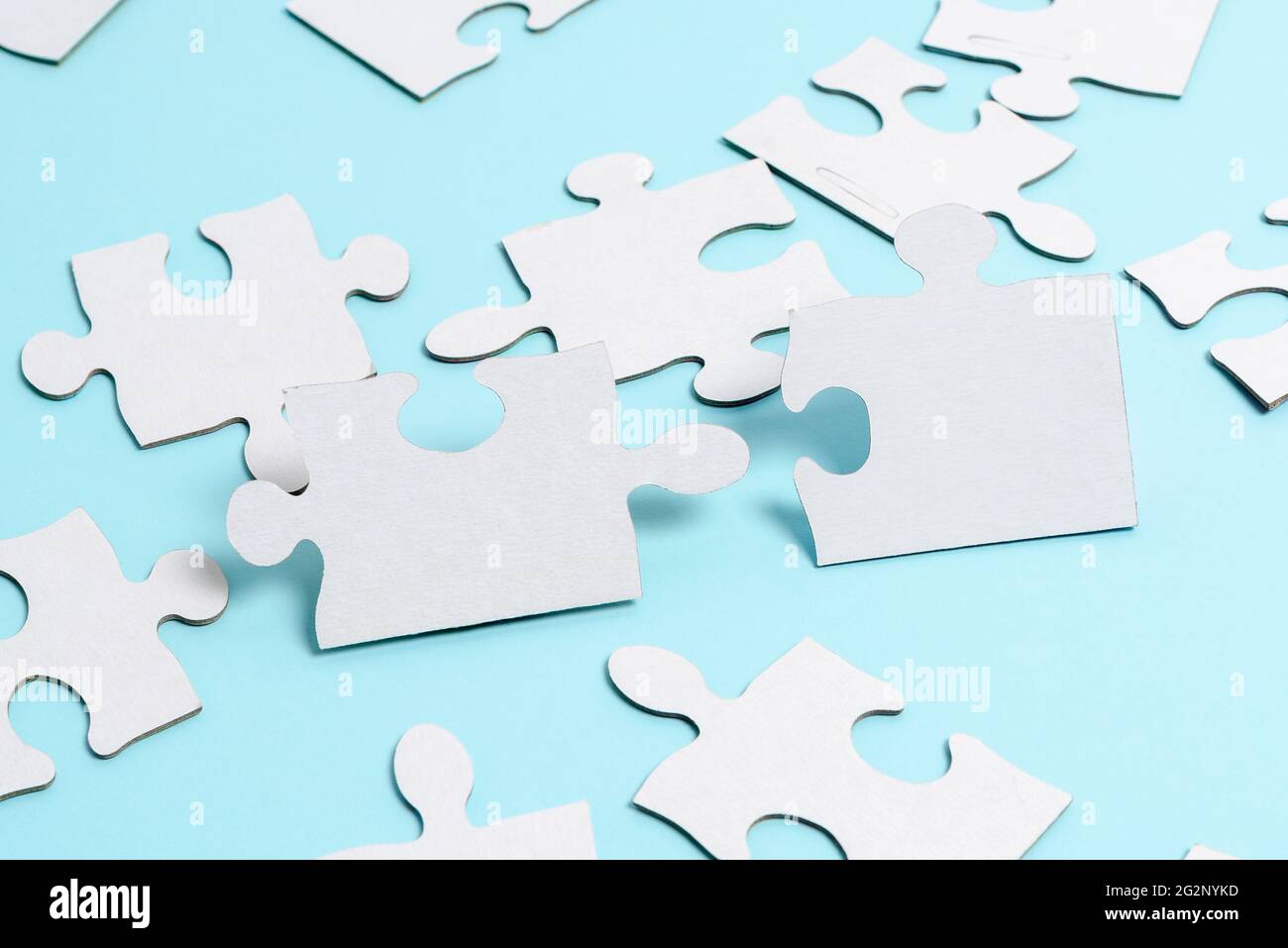 Building An Unfinished White Jigsaw Pattern Puzzle With Missing Last ...