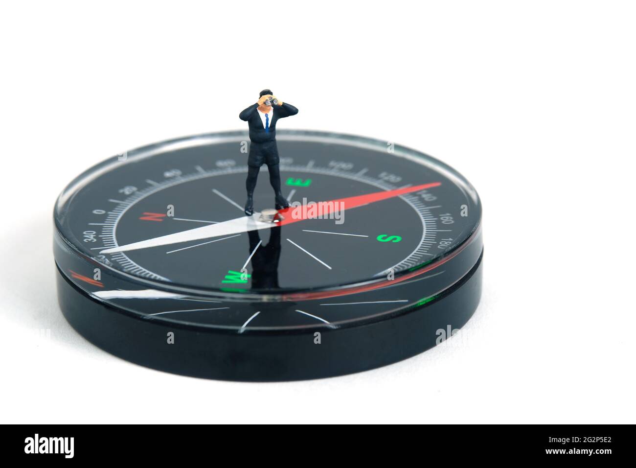 Man using compass on map Cut Out Stock Images & Pictures - Alamy