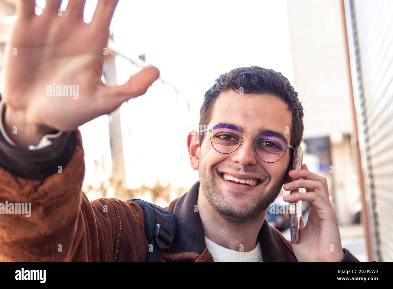 Boy waving goodbye hi-res stock photography and images - Alamy