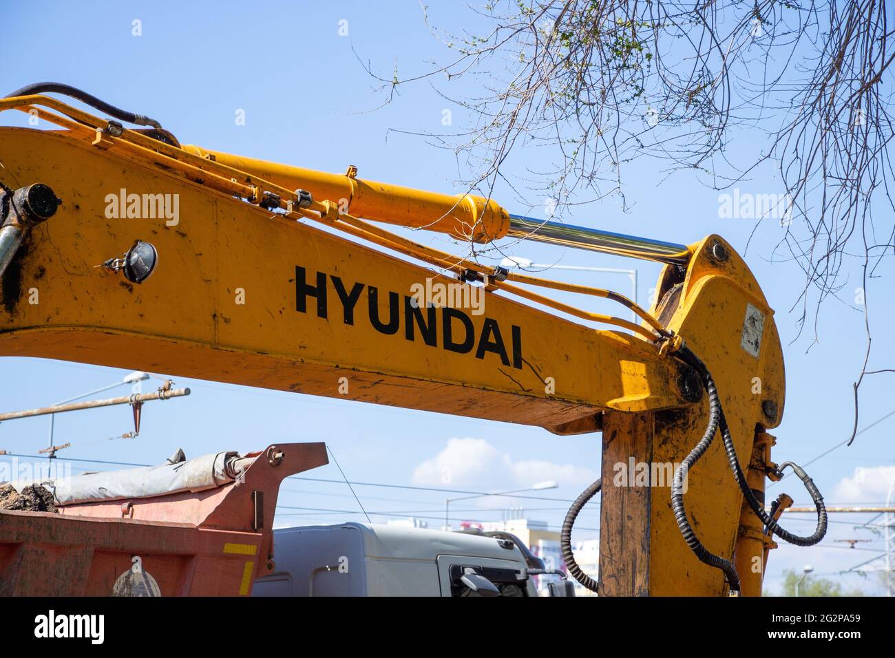 Samara, Russia - May 06, 2021: A modern excavator performs earthworks ...