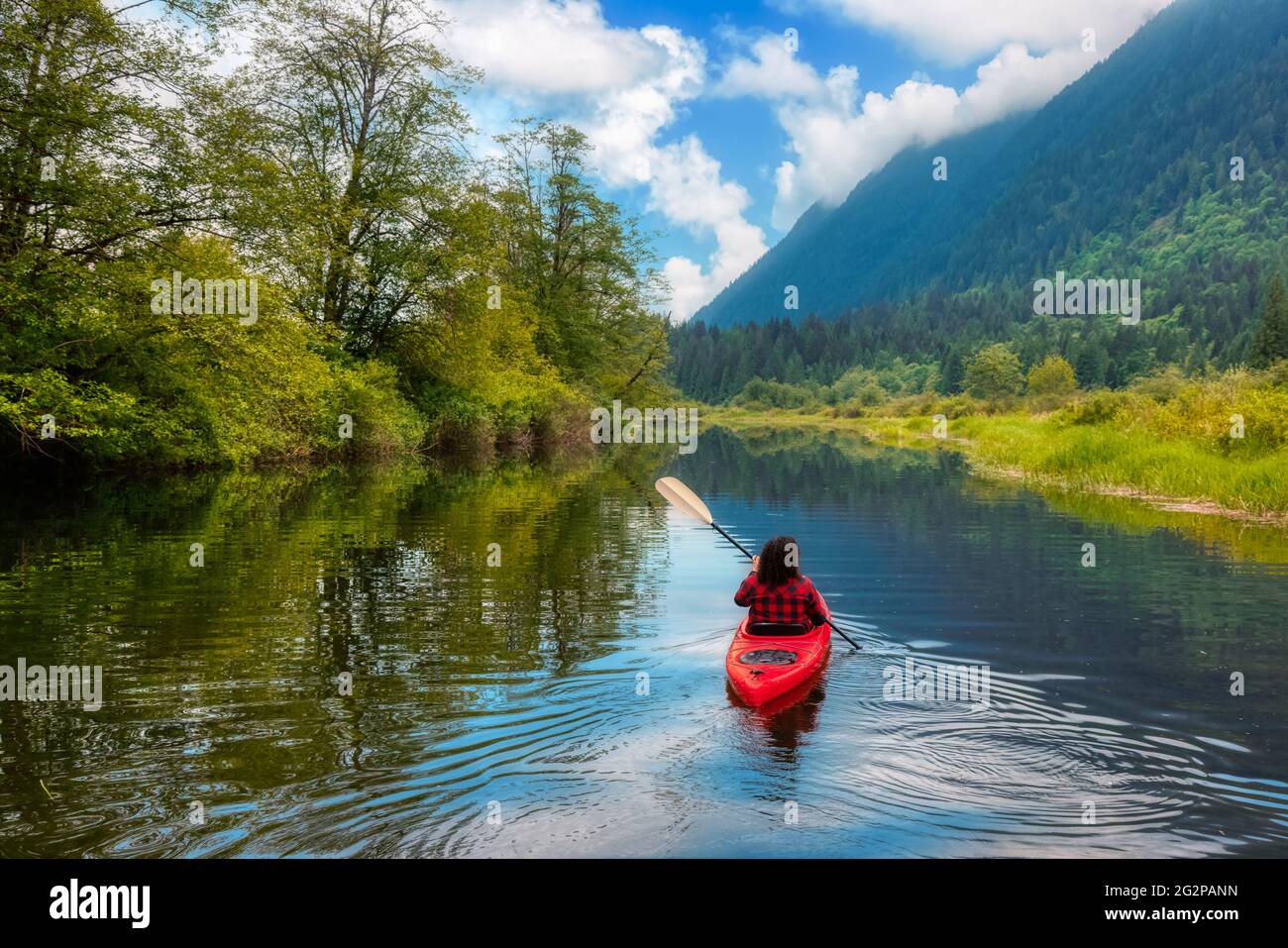 Adventure Caucasian Adult Woman Kayaking in Red Kayak Stock Photo - Alamy