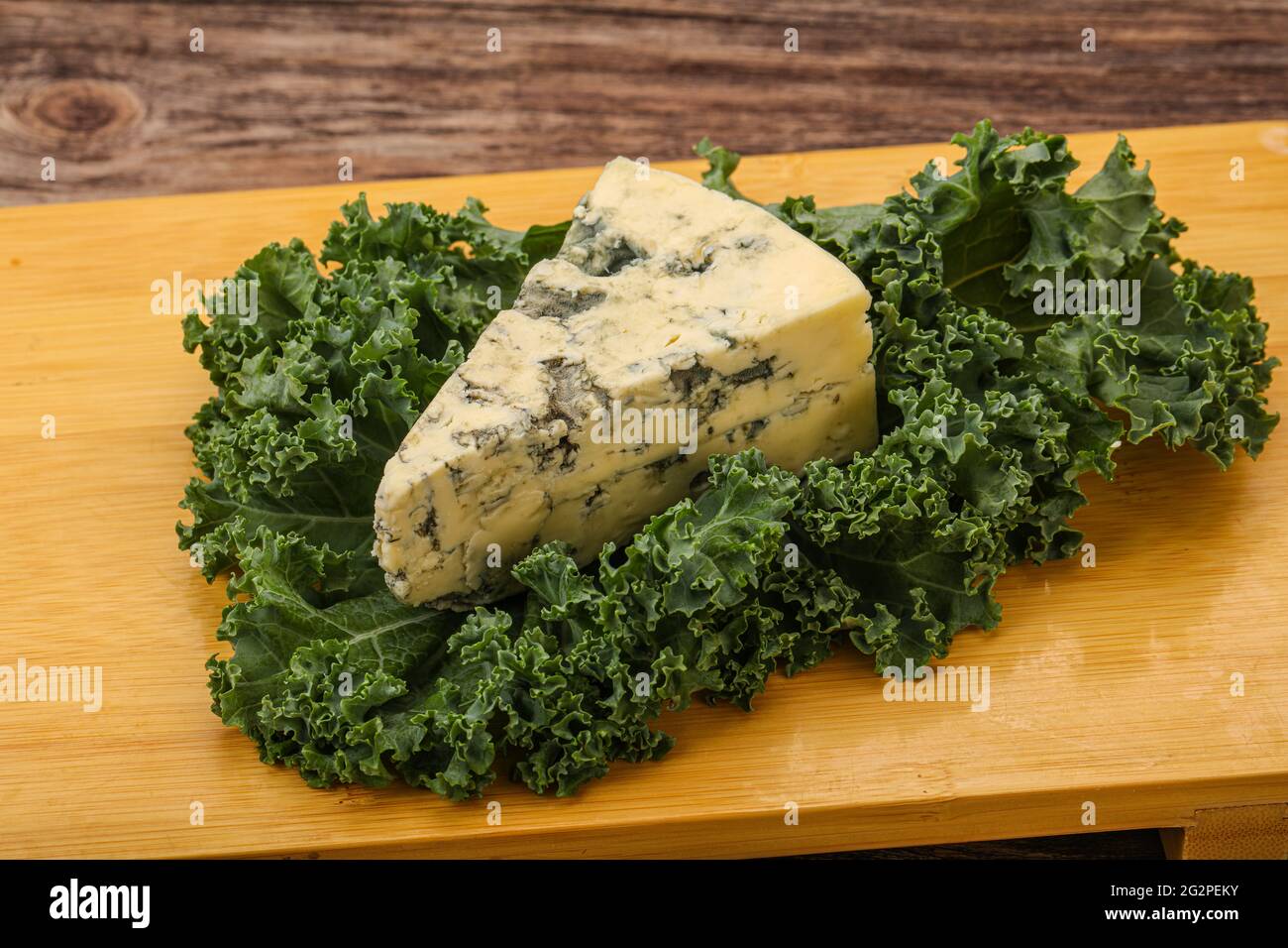 Dairy Blue cheese triangle with mold Stock Photo - Alamy