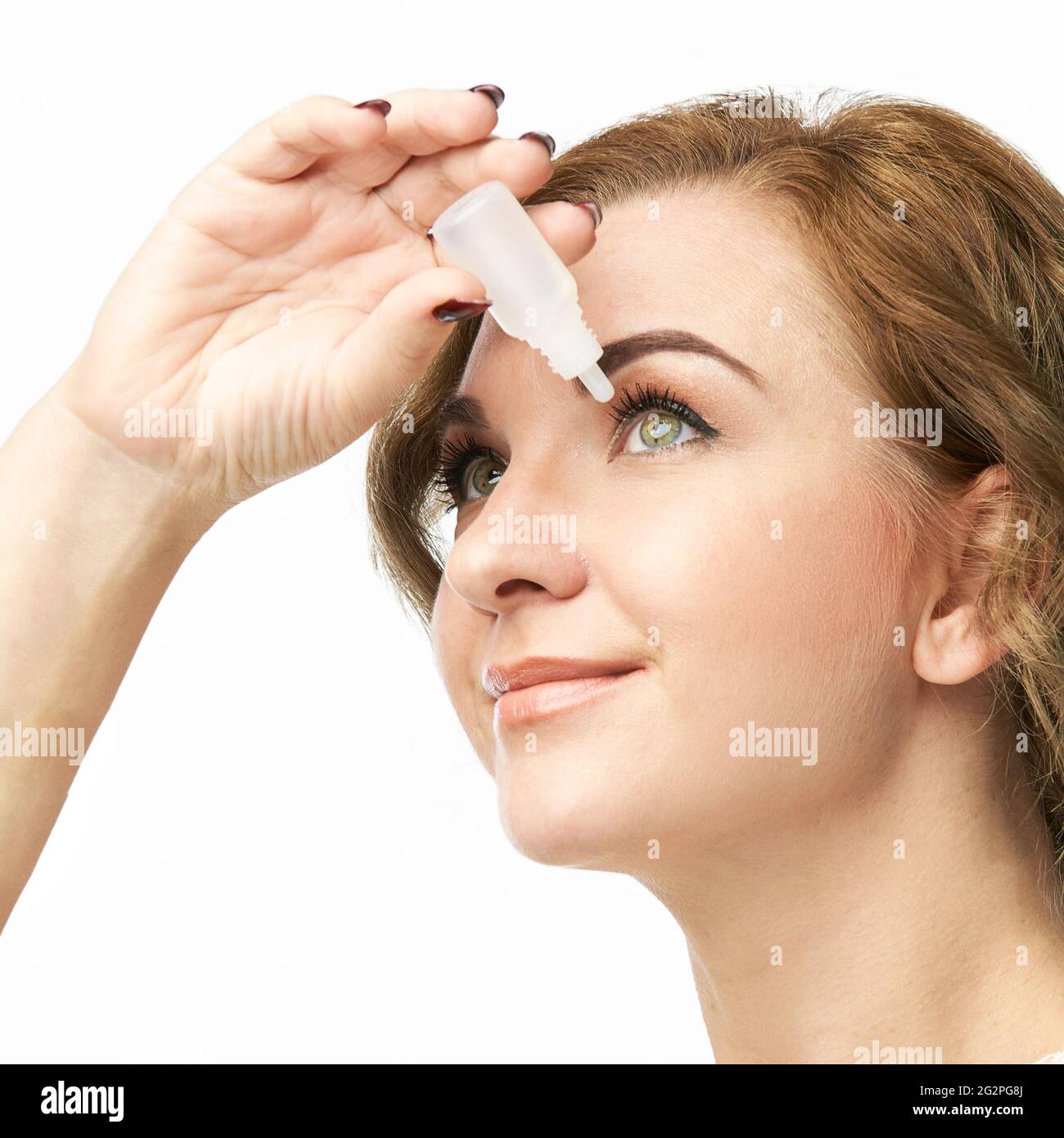 Woman putting eye drops hi-res stock photography and images - Alamy
