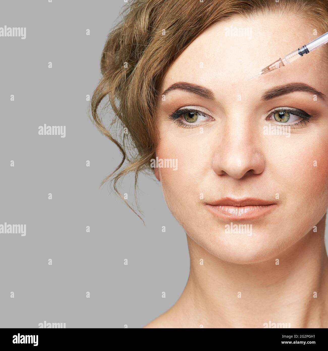 Face needle injection. Young woman cosmetology procedure. Doctor hand ...