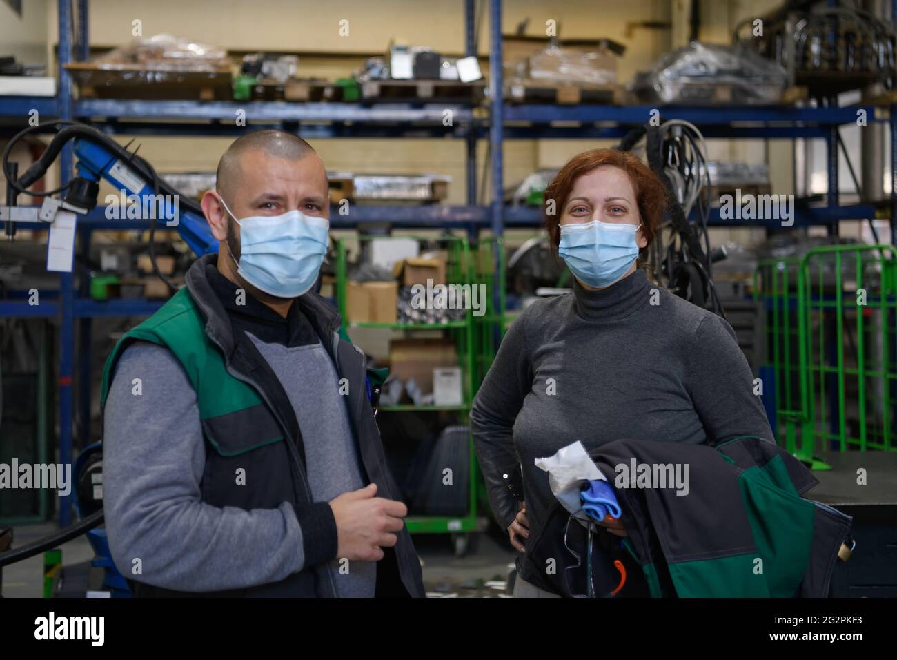 Industrial workers with face masks protected against corona virus ...