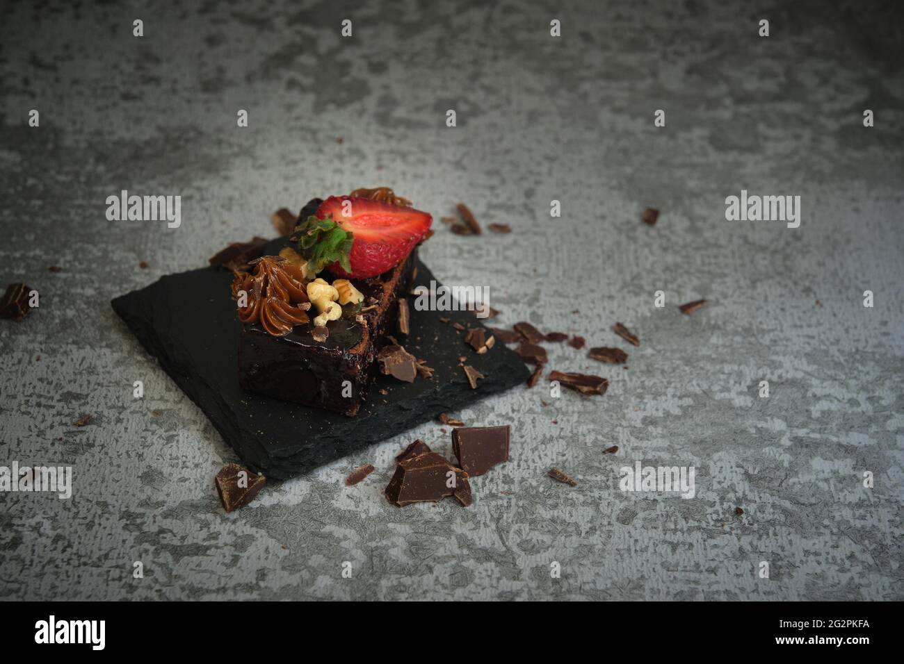 chocolate cake with strawberries on a gray background Stock Photo - Alamy
