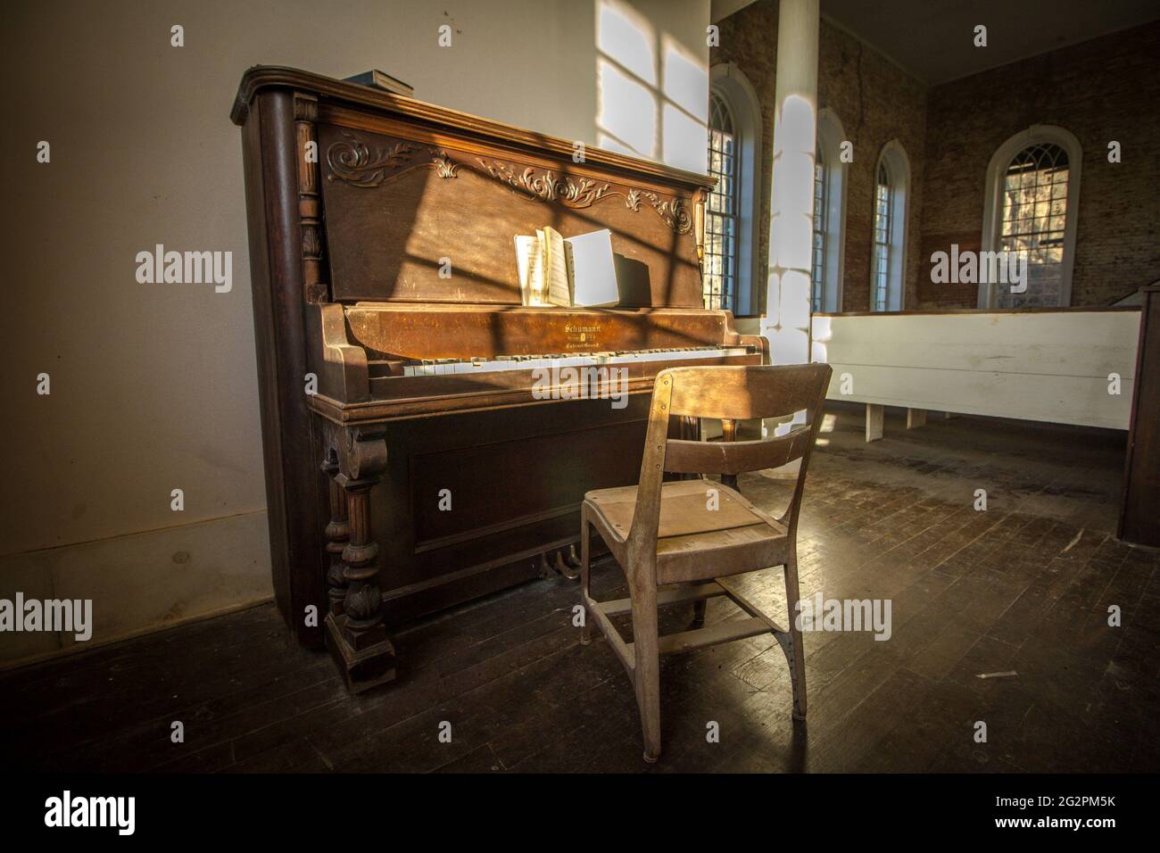 Piano and pews inside Catholic church in Rodney, Mississippi Stock ...