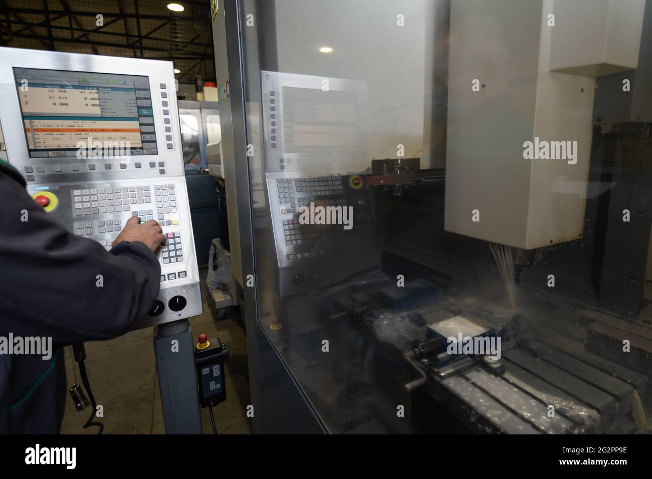 close up a worker hand or engineer introducing a program into a modern ...