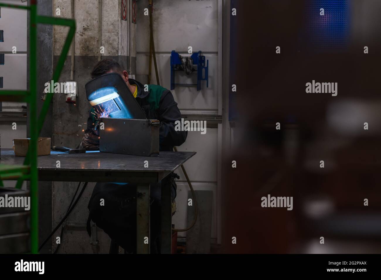 Professional welder performs welding hi-res stock photography and ...