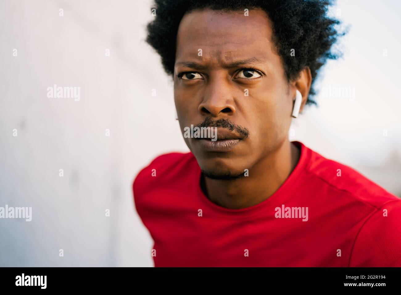 Athletic man running and doing exercise outdoors Stock Photo - Alamy