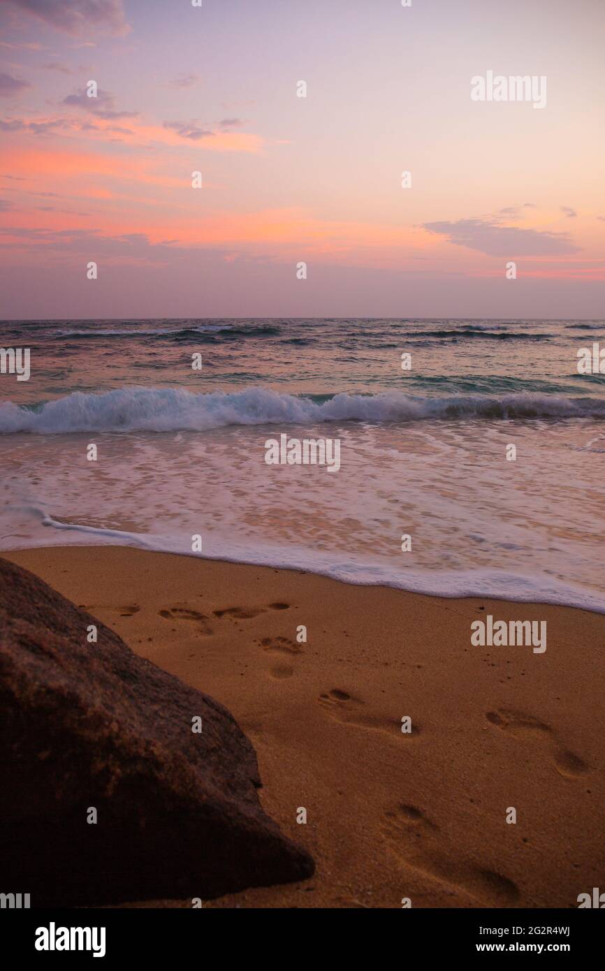 Beautiful pink sunset by the raging ocean, summer background Stock ...