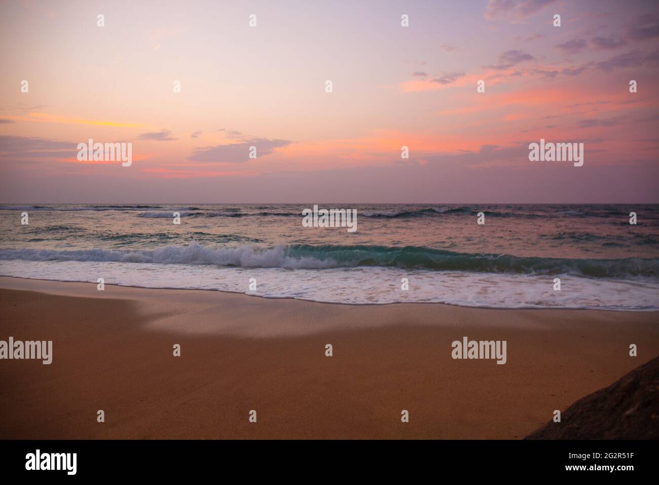 Beautiful pink sunset by the raging ocean, summer background Stock ...
