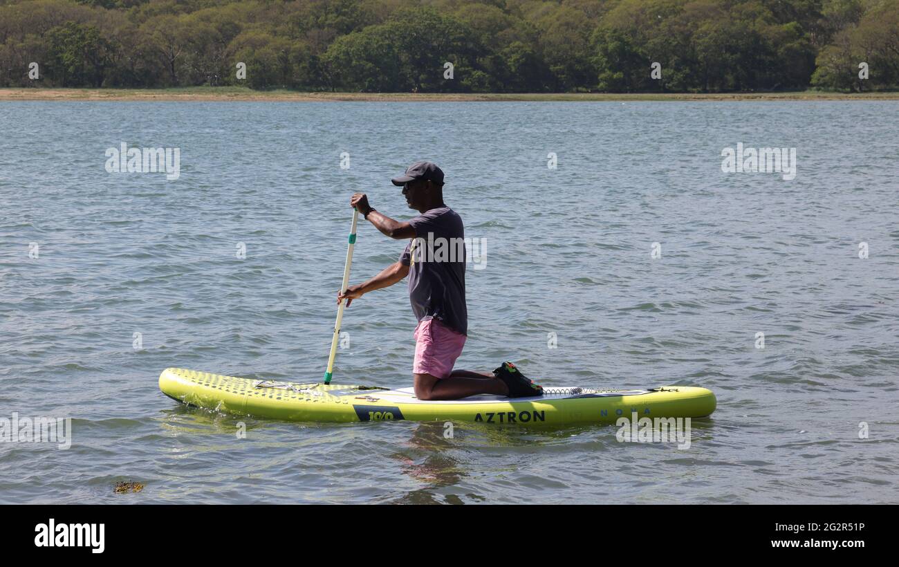 Paddle boarding England UK Stock Photo - Alamy