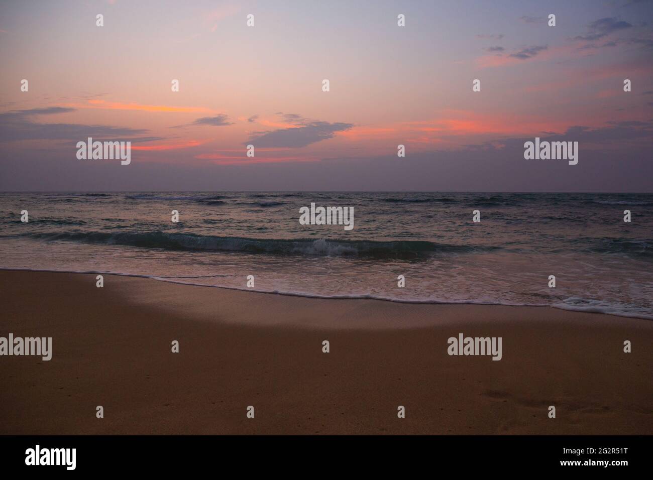 Beautiful pink sunset by the raging ocean, summer background Stock ...