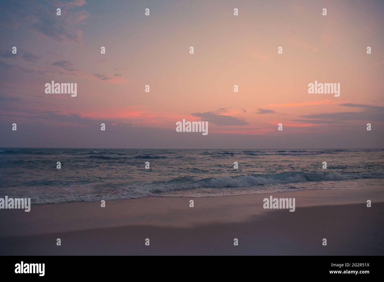 Beautiful pink sunset by the raging ocean, summer background Stock ...