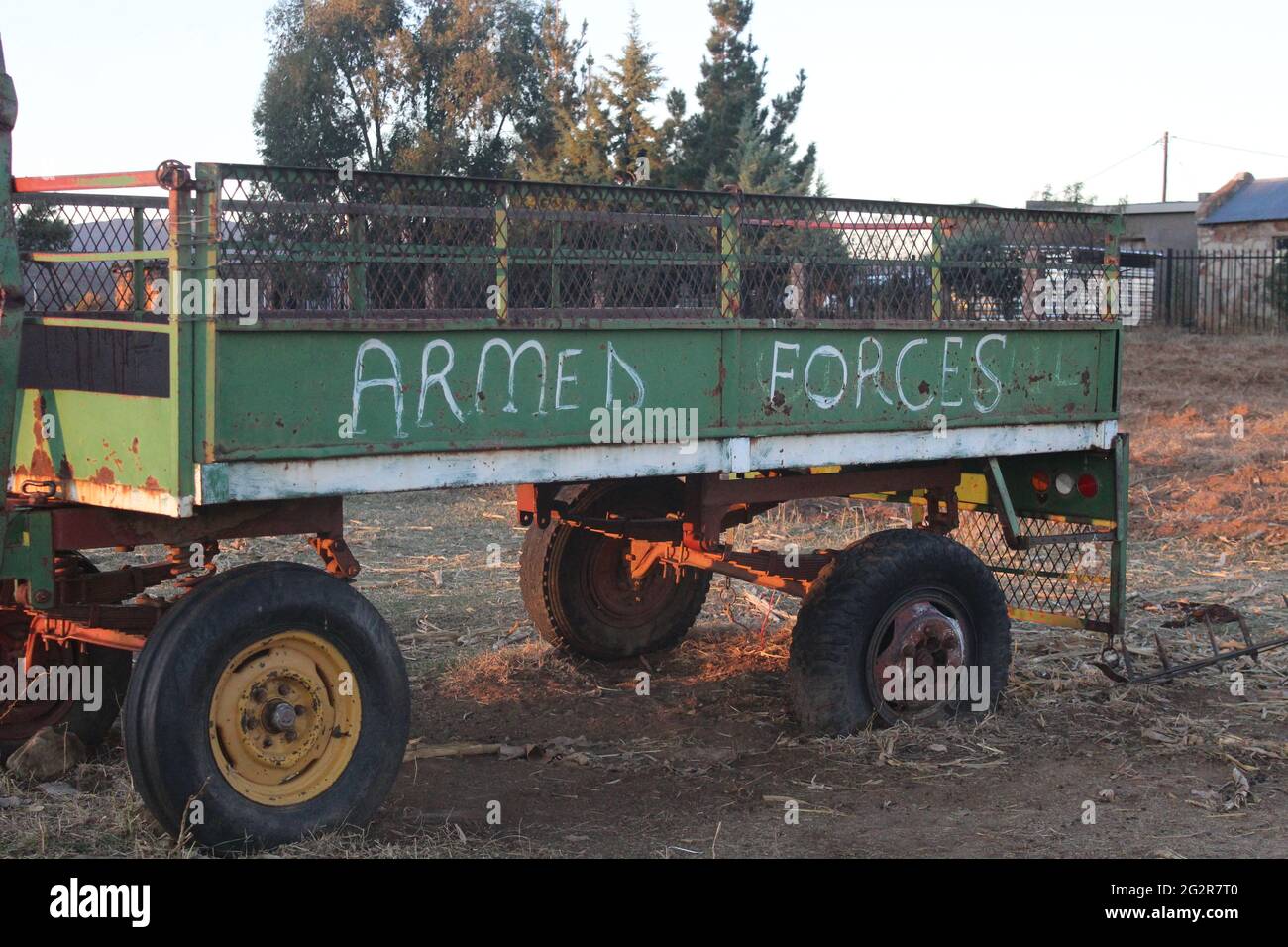 A bodyguard fixes Basotho Action Party leader Nqosa Mahao's face mask ...