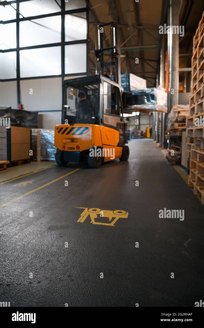 Forklift loader in storage warehouse ship yard. Distribution products ...