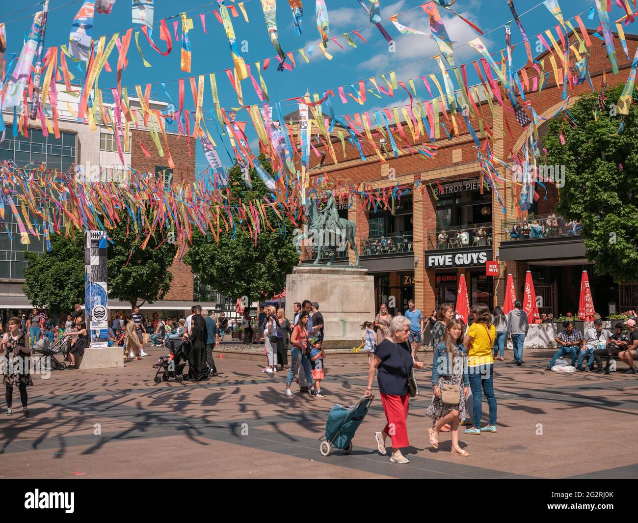 Broadgate, Coventry. Broadgate square is decorated with flags and ...