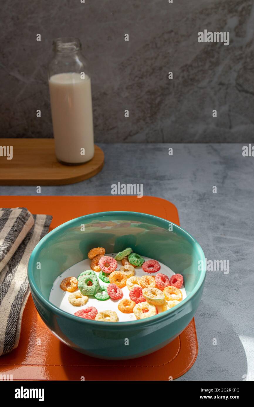 Breakfast with colored cereal served in a colored bowl Stock Photo - Alamy