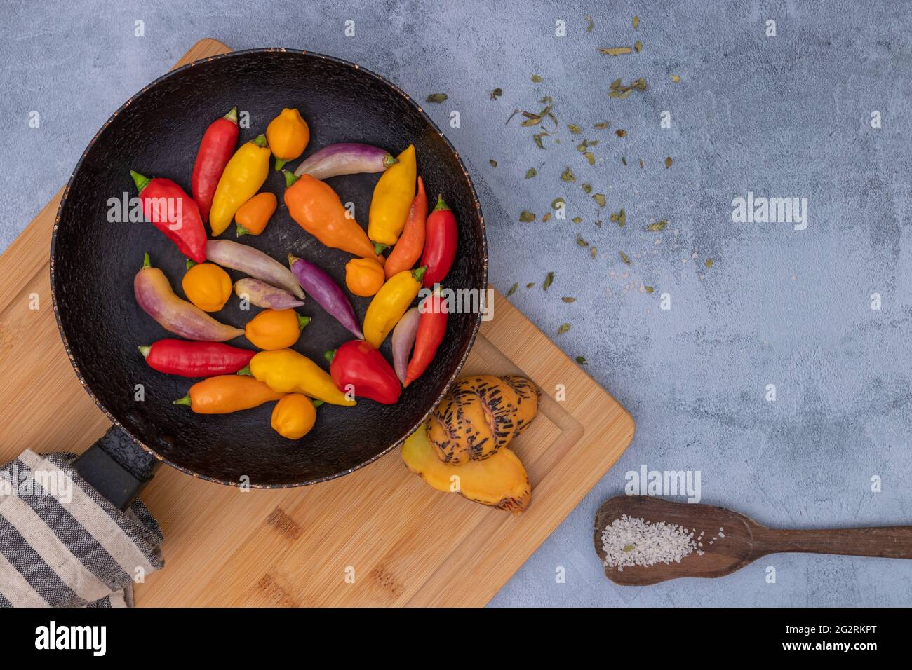 Peruvian chili peppers of various colors on gray background Stock Photo ...