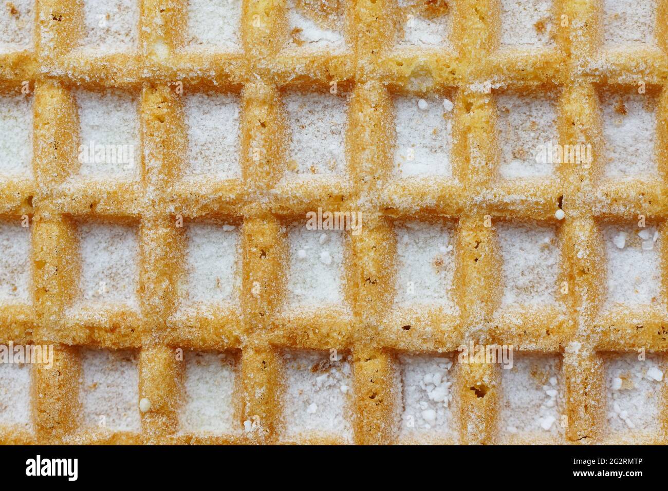 Overhead shot of a sugar waffle with sugar powder Stock Photo - Alamy