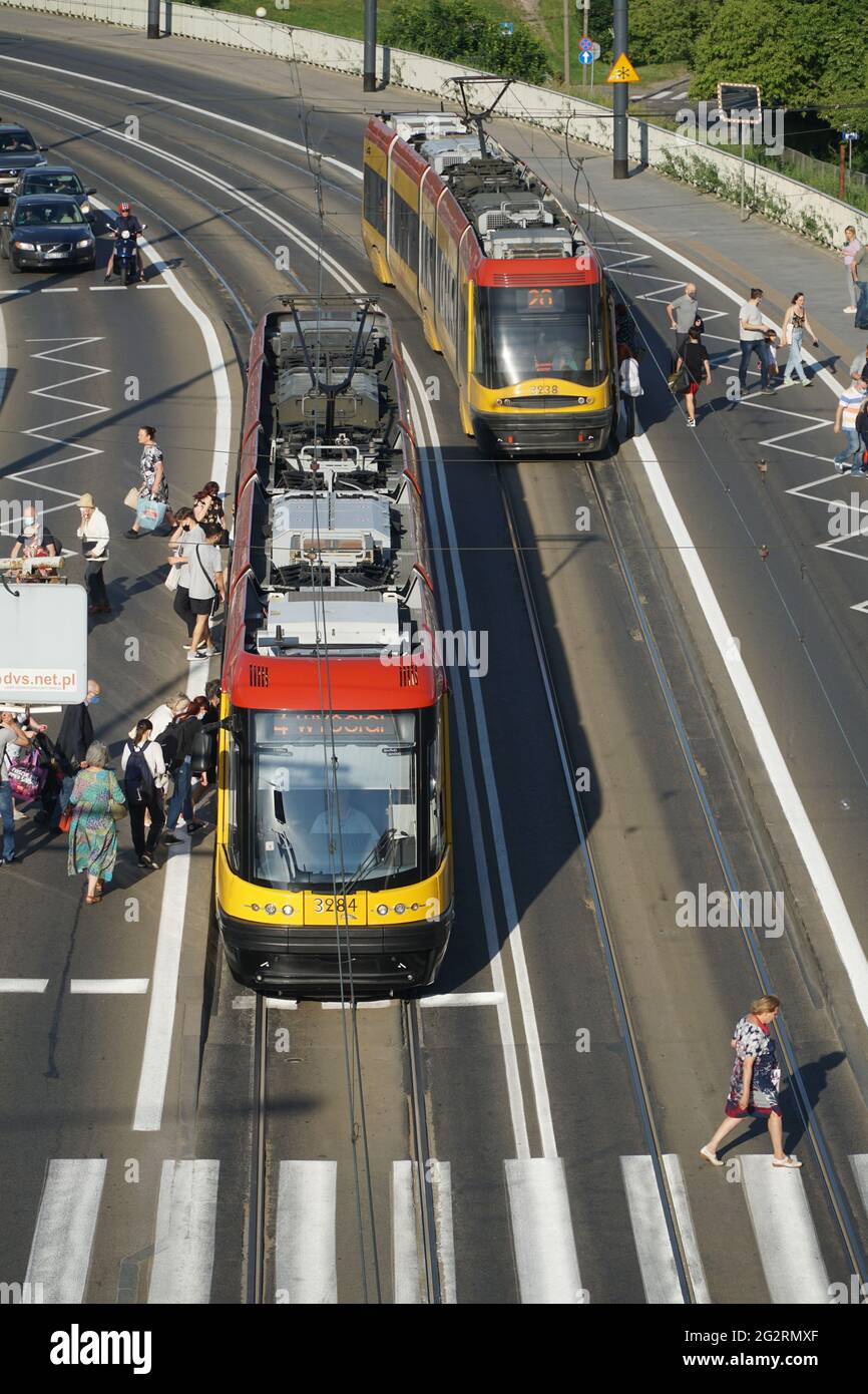 Warsaw public transport in the city centre at Old City stop. Trams ...
