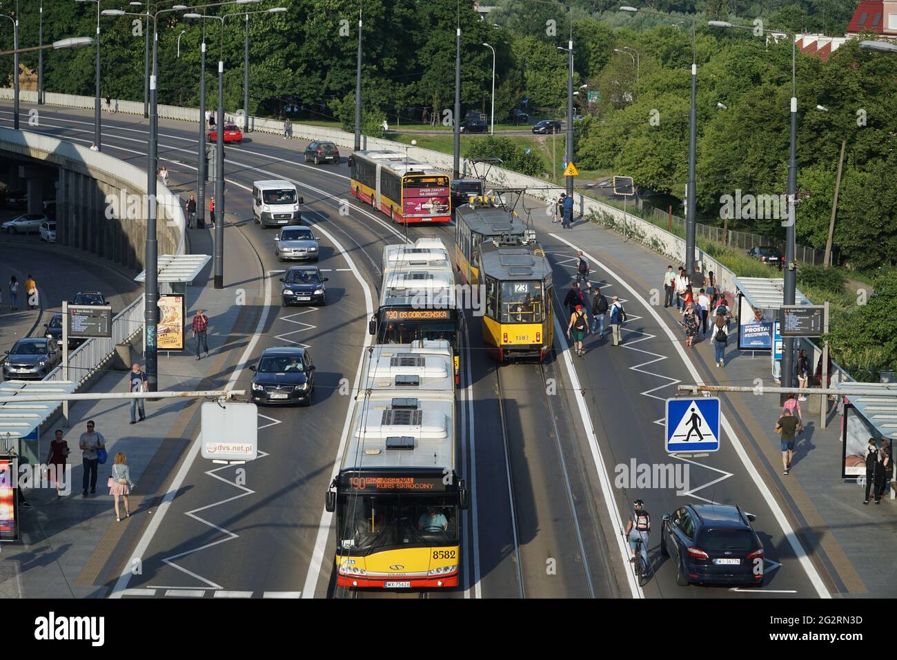 Warsaw public transport in the city centre at Old City stop. Buses and ...