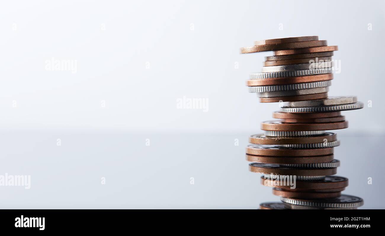Falling stack of coins. Euro coins stacked on each other in different ...