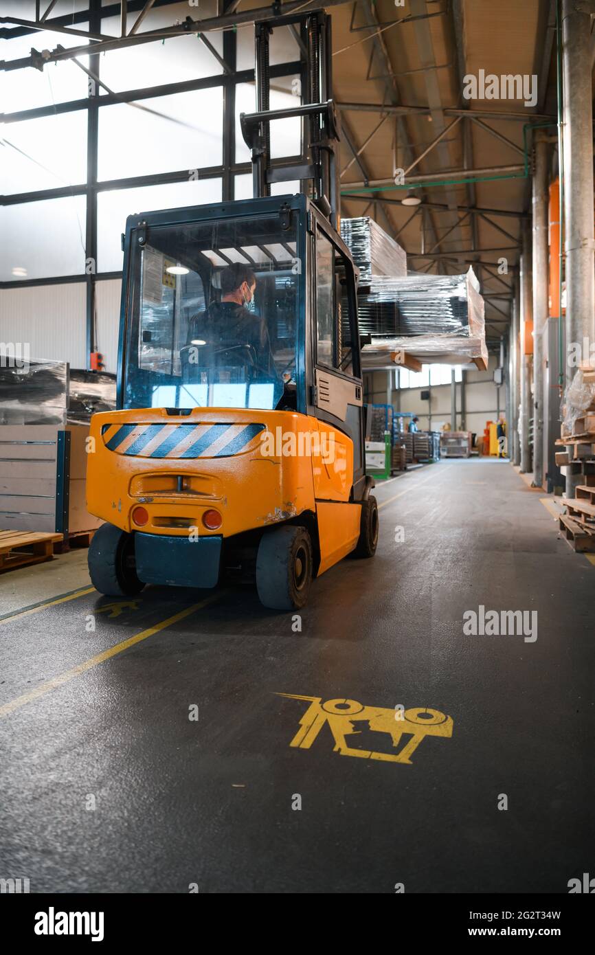 Forklift loader in storage warehouse ship yard. Distribution products ...