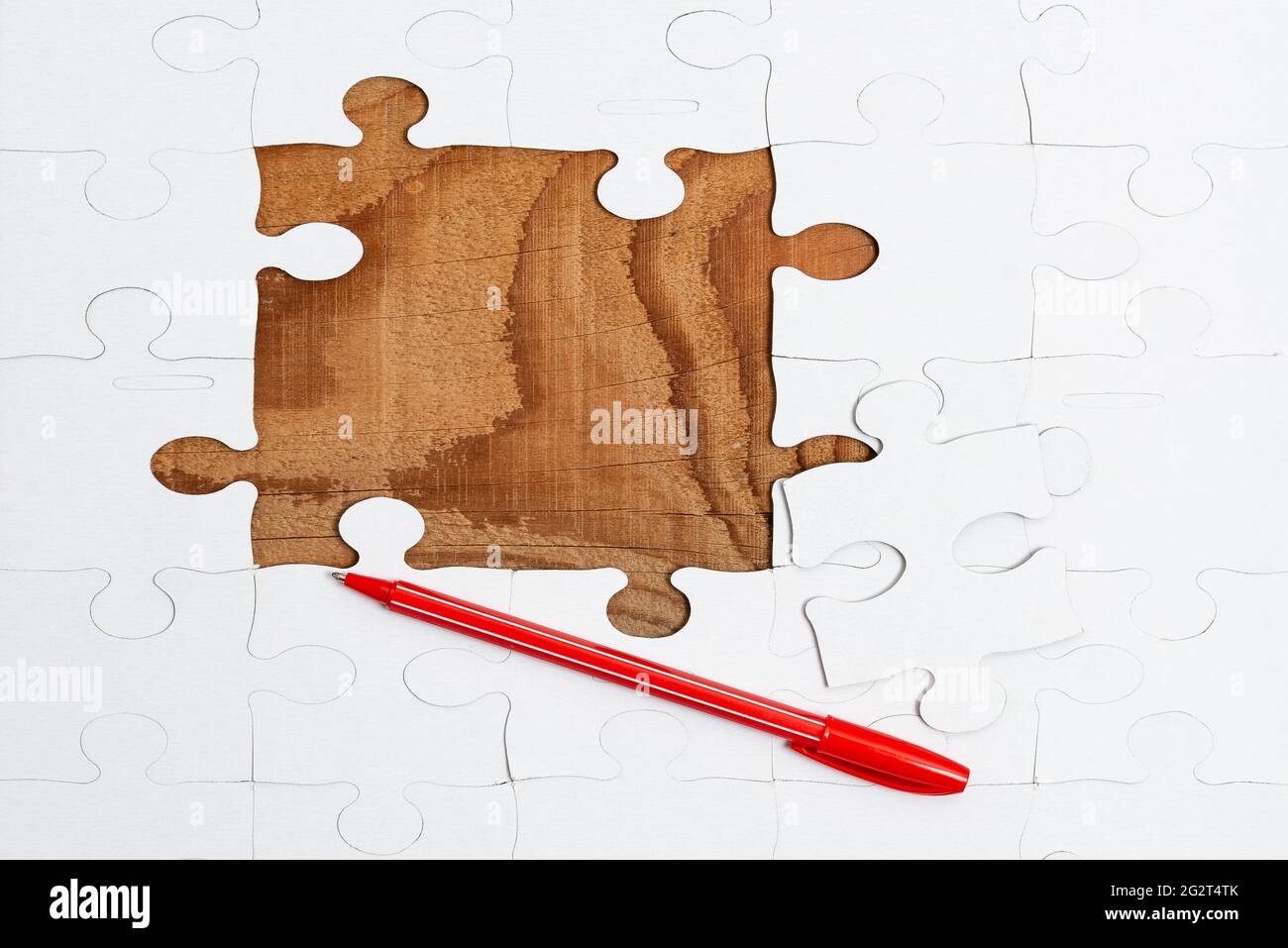 Building An Unfinished White Jigsaw Pattern Puzzle With Missing Last ...