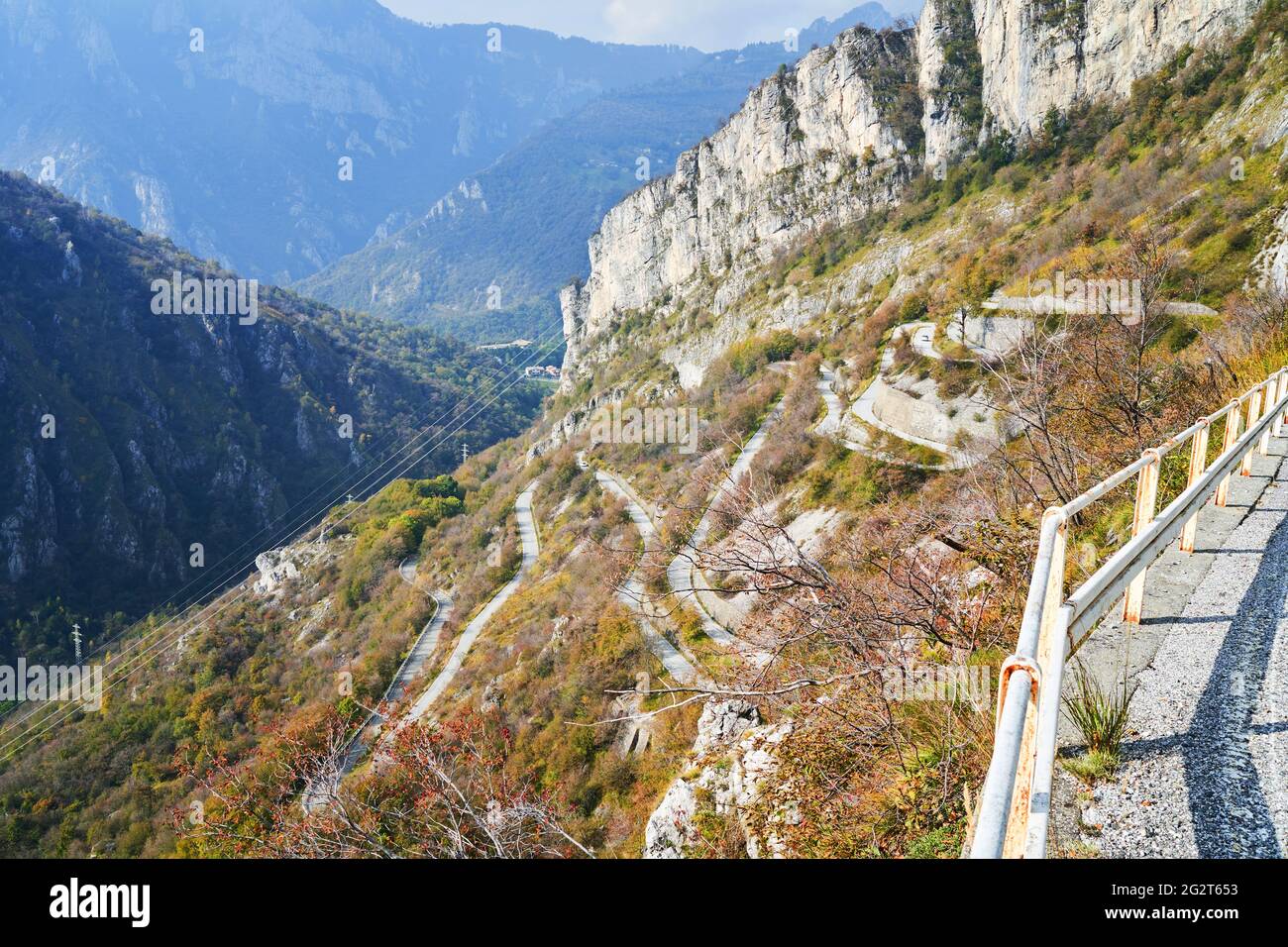 Serpentine mountain road, picturesque Alps autumn landscape. Lombardy ...