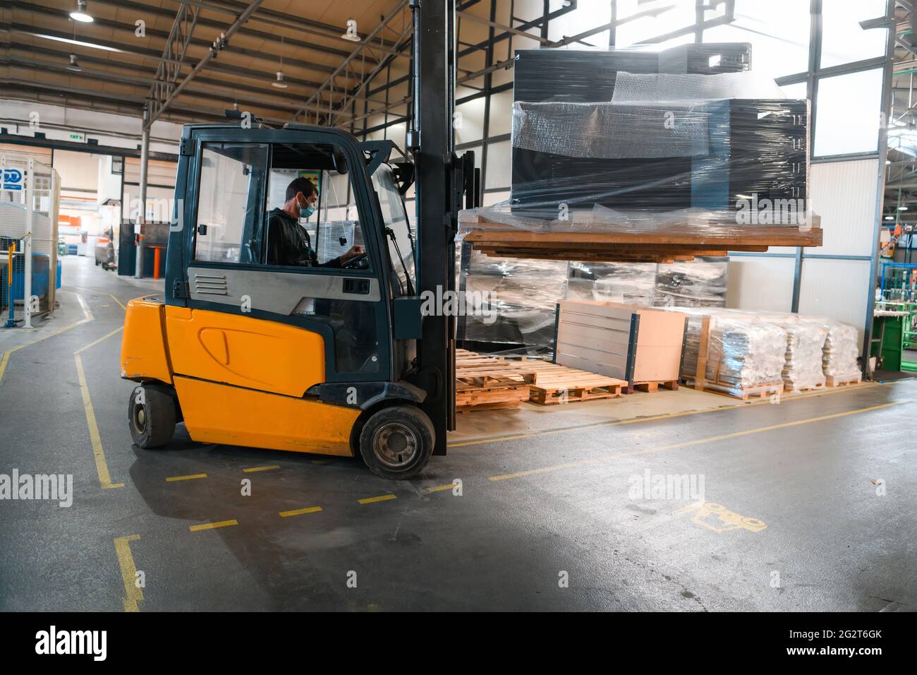 Forklift loader in storage warehouse ship yard. Distribution products ...