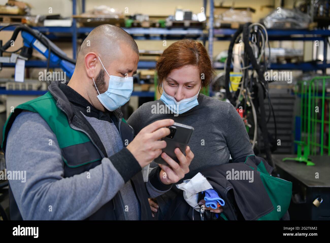 Industrial workers with face masks protected against corona virus ...