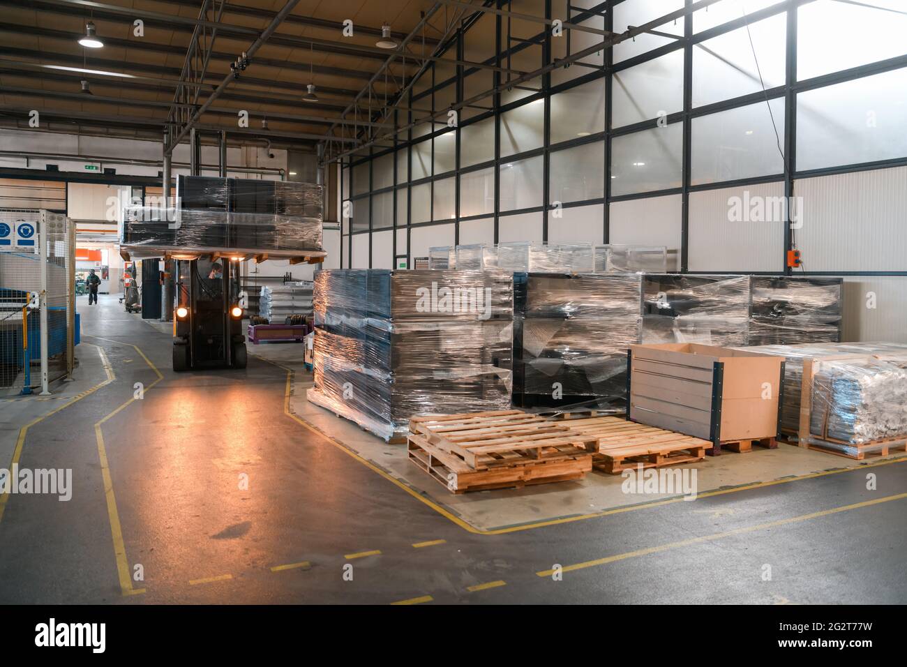 Forklift loader in storage warehouse ship yard. Distribution products ...