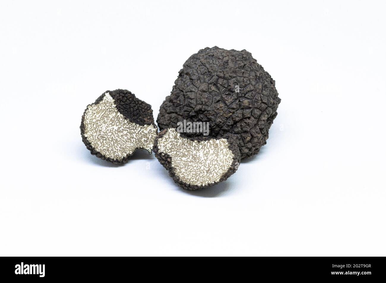 black truffle, tuber aestivum, cut, slice, open, photographed on a ...