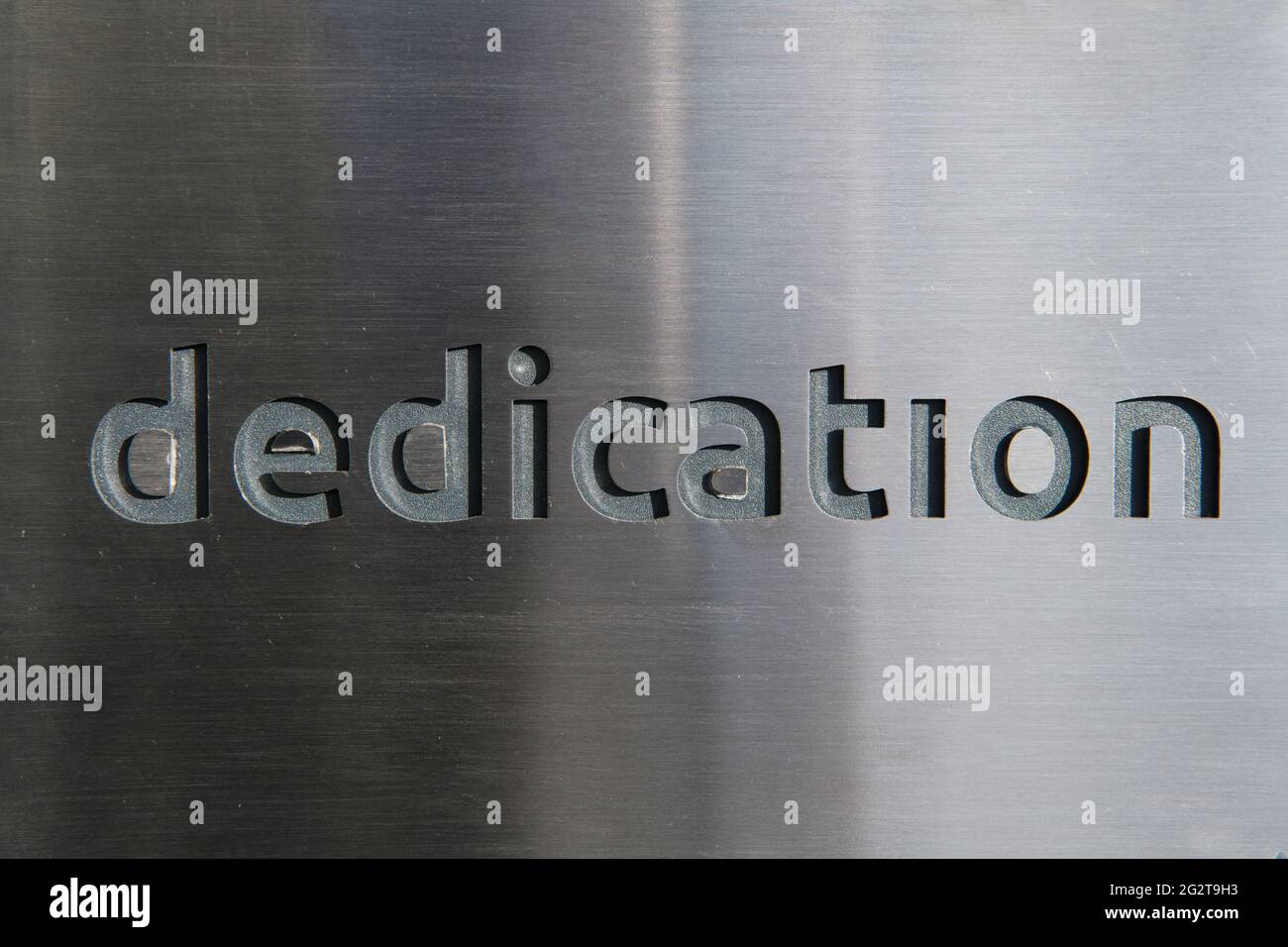 engraving a cnc machine on a piece of metal. Engraving dedication text ...