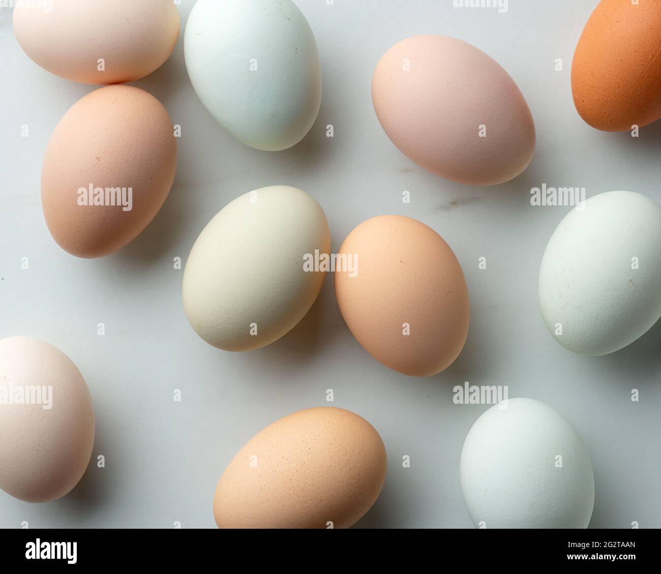 fresh raw bio eggs background, top view Stock Photo - Alamy