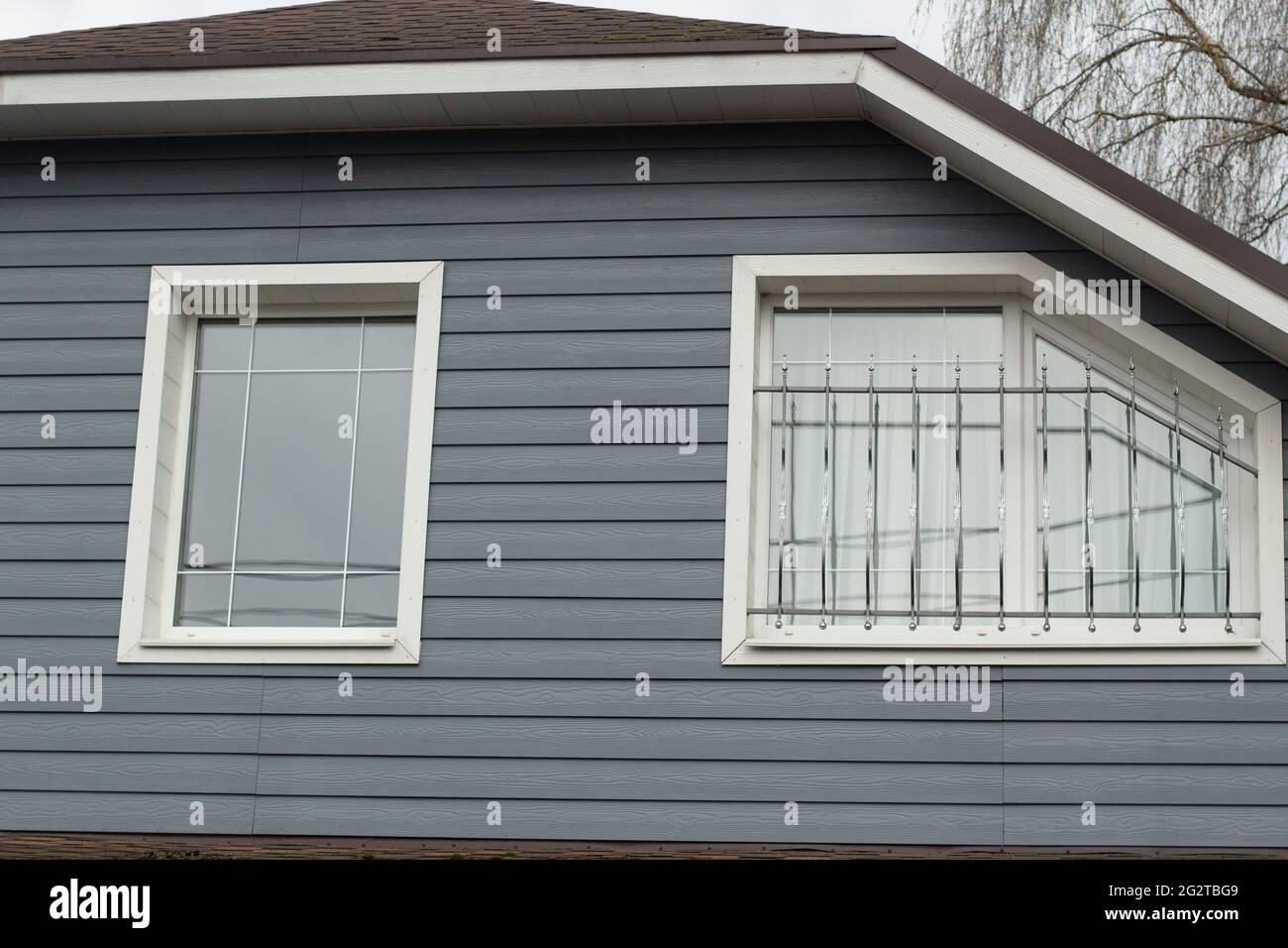 Country house outside the city. Residential building windows. Cozy ...