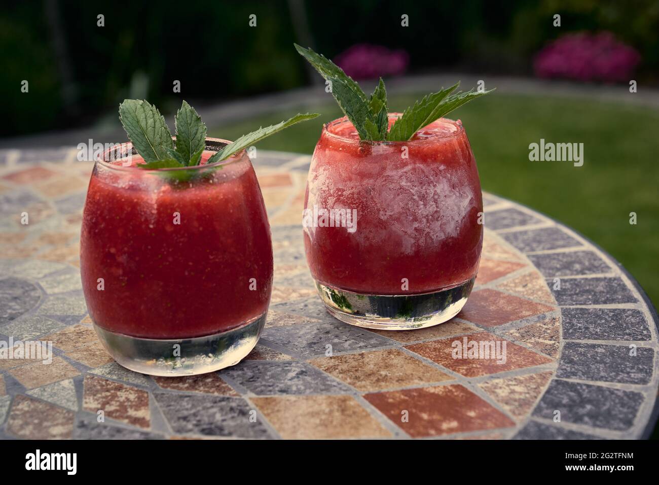 freezing summer cocktail with strawberry. Glass of strawberry soda ...
