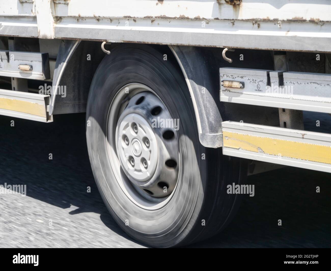Closeup of a wheel of running truck on the road Stock Photo - Alamy