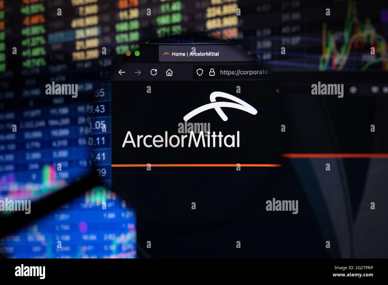 ArcelorMittal company logo on a website with blurry stock market ...